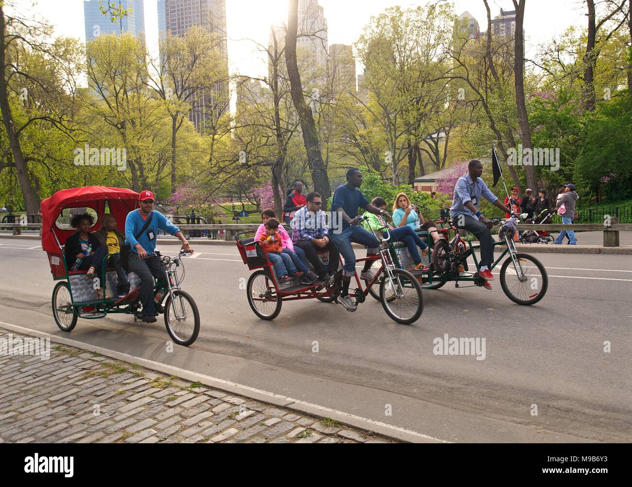 Three rickshaws race up the hill Central Park - New York April 2012 ...