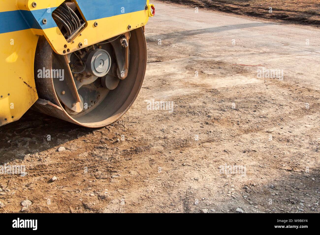 Road roller working at road construction site. Detailed view of a road ...