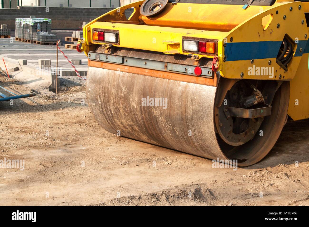 Road roller working at road construction site. Detailed view of a road ...