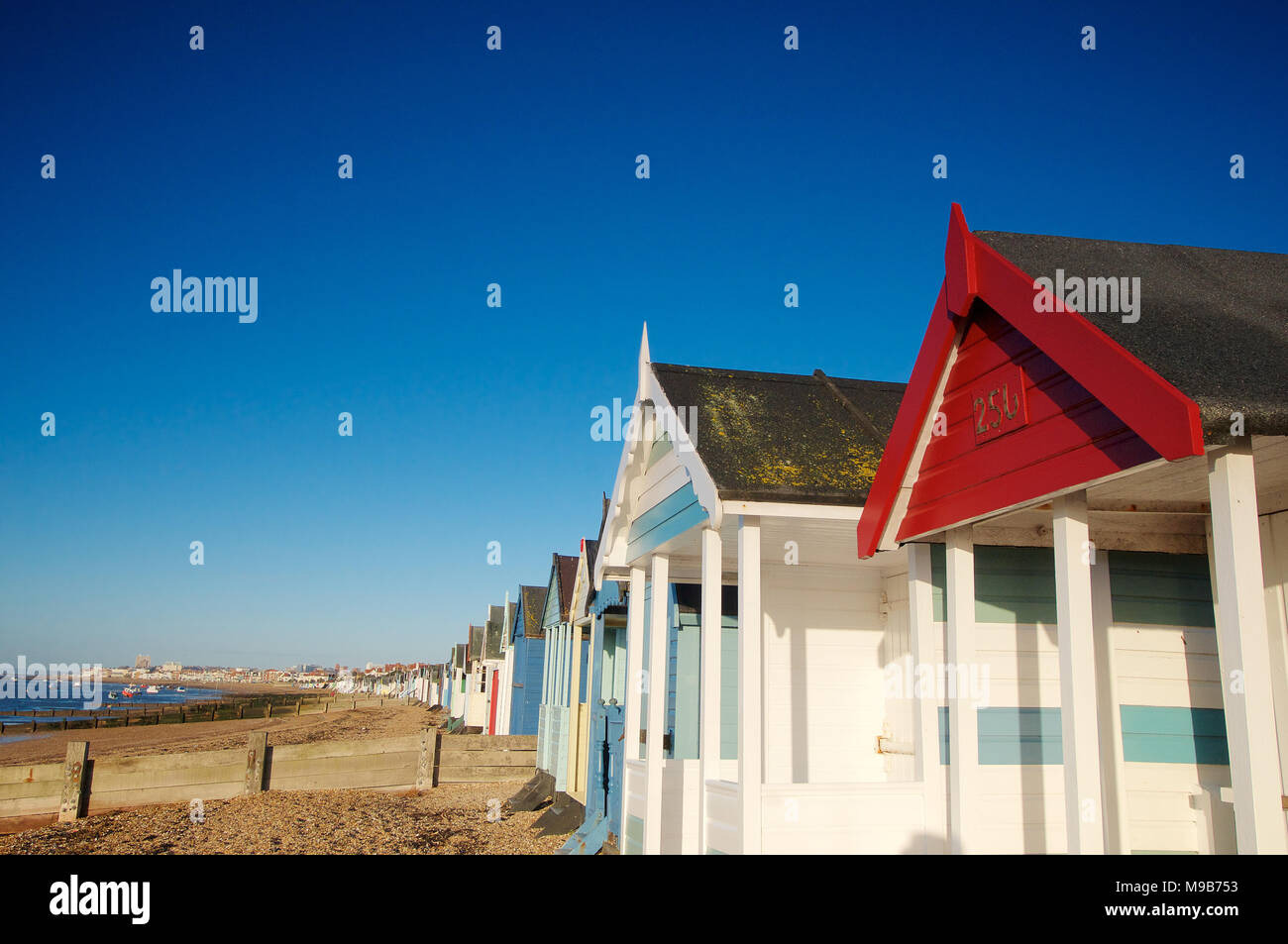 A row of colourful beach huts on the beach at Thorpe Bay, Southend-on ...