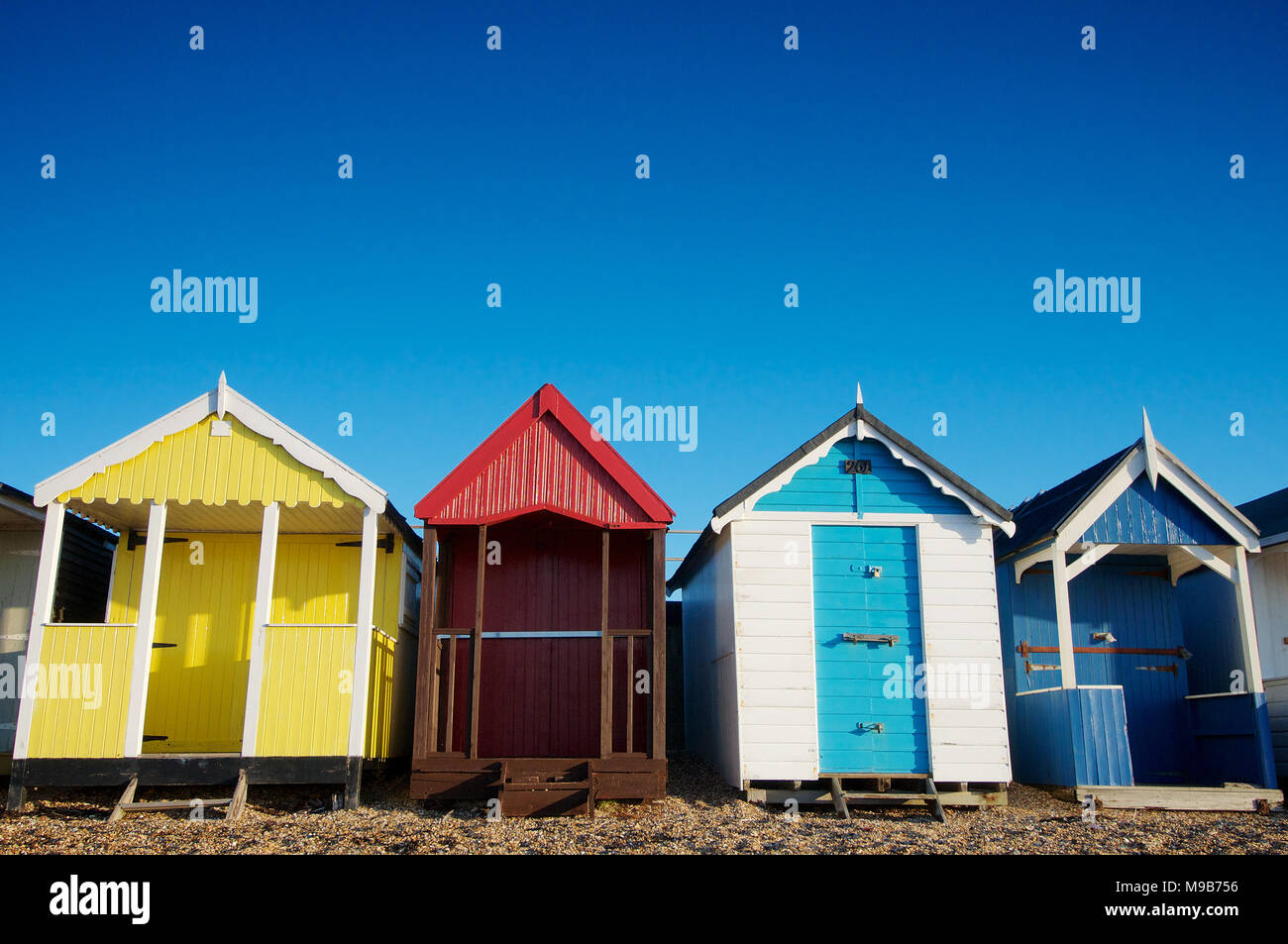 A row of colourful beach huts on the beach at Thorpe Bay, Southend-on ...