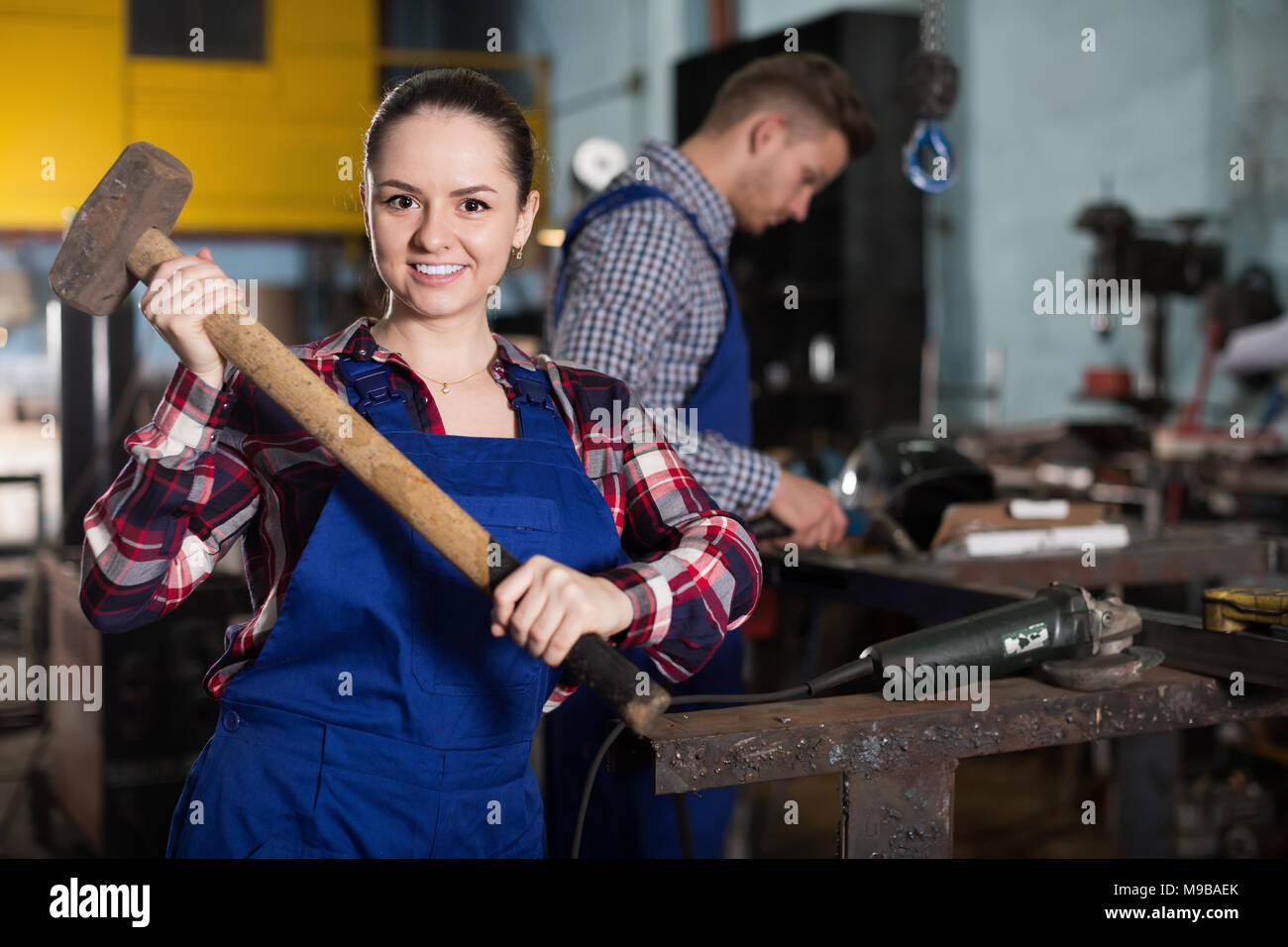Female artisan with sledgehammer hi-res stock photography and images ...