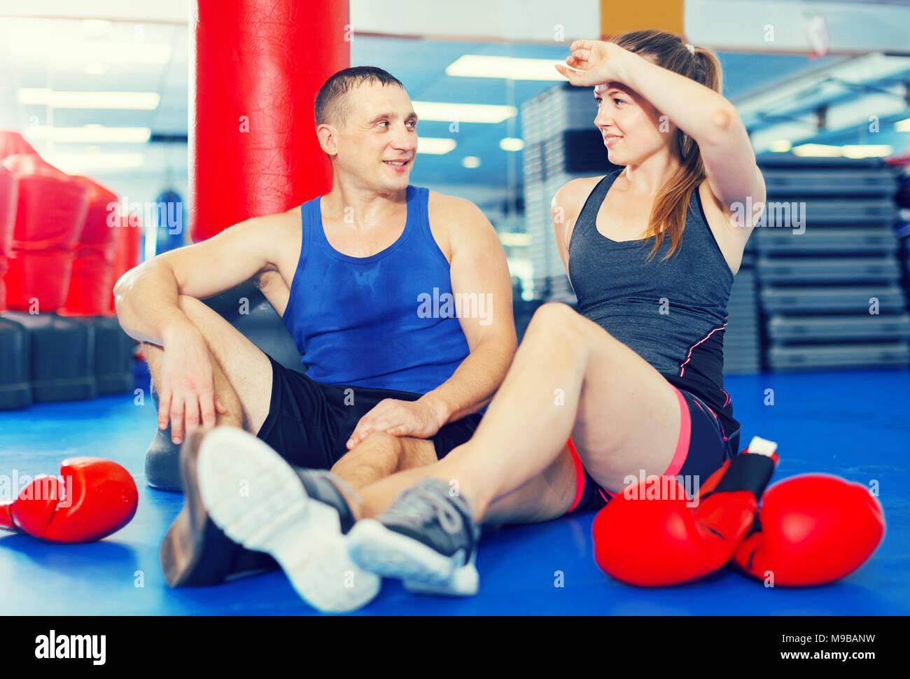 happy french female boxer is sitting with man and talking about healthy ...