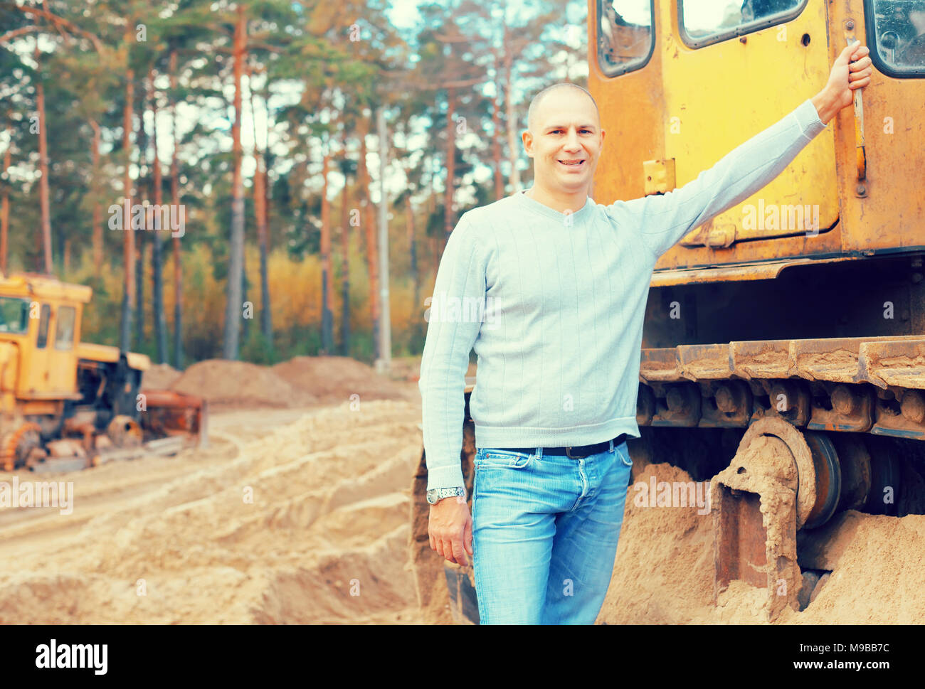 Portrait of tractor operator at workplace Stock Photo - Alamy