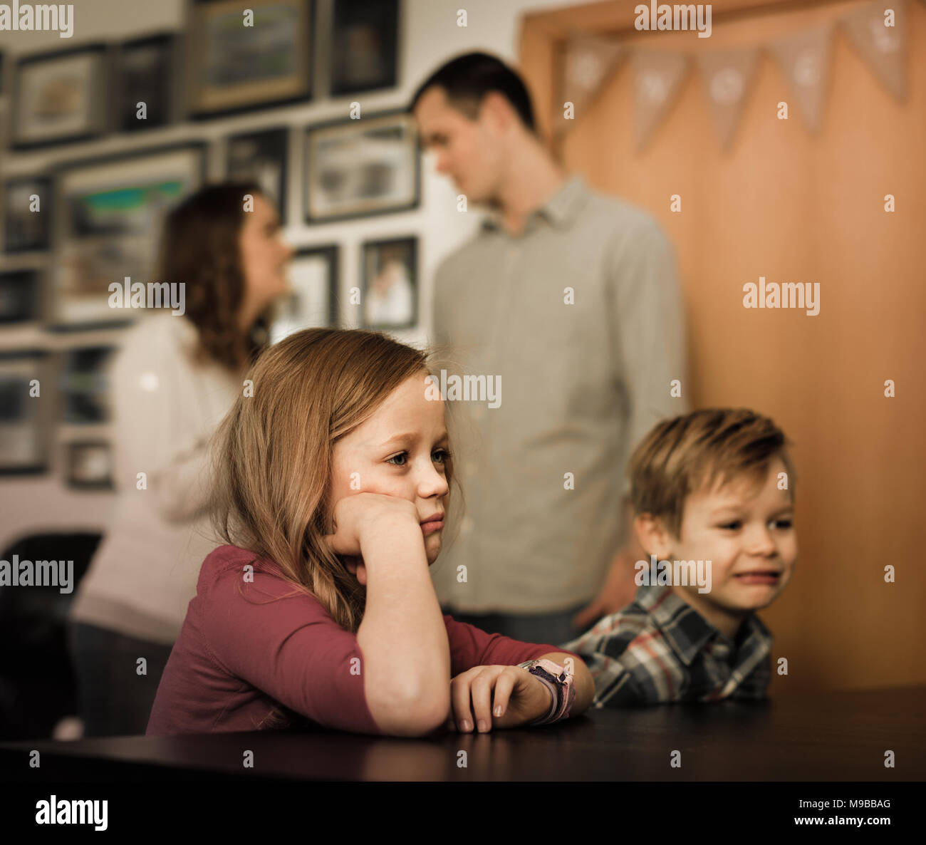 Young parents having bad row while their children at home Stock Photo ... Young parents having bad row while their children at home Stock Photo ...