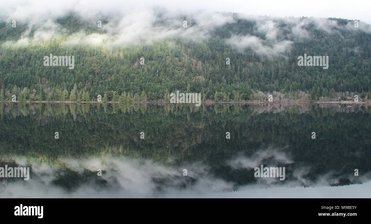 Calm and peaceful lake with reflection Stock Photo - Alamy