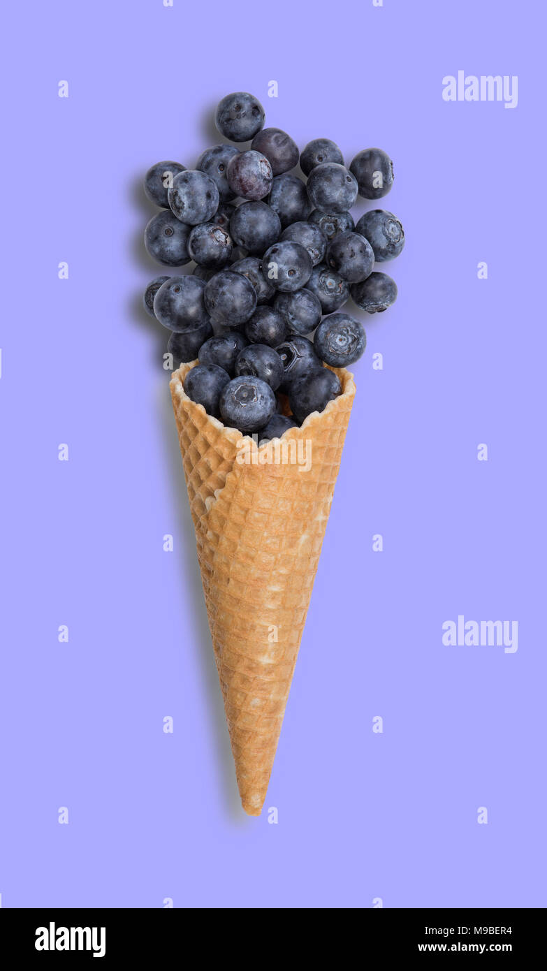 Blueberry ice cream cone with fresh fruits Stock Photo - Alamy