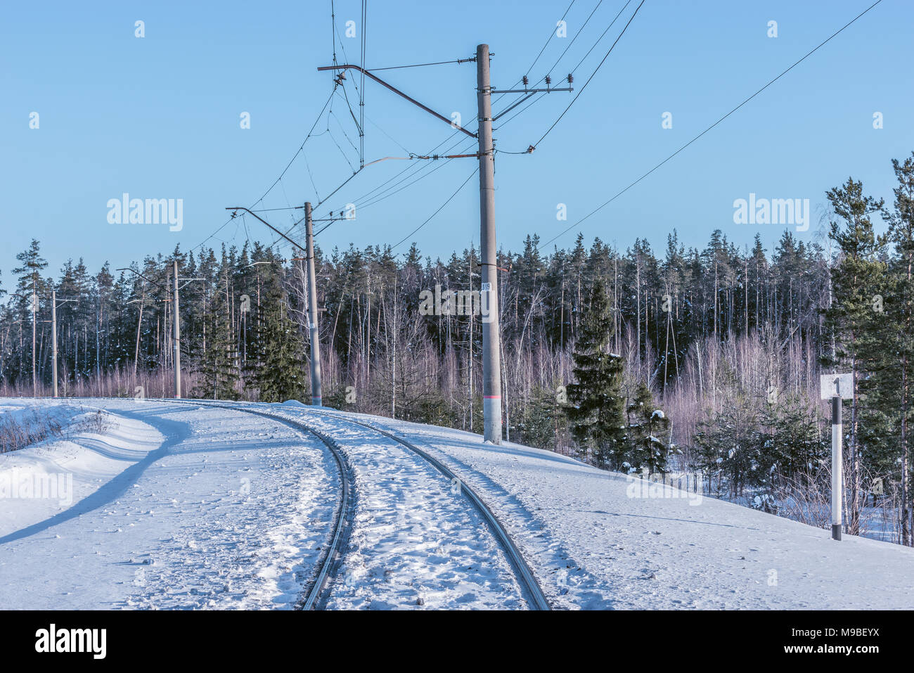 Electric railway line at sunny winter day time Stock Photo - Alamy