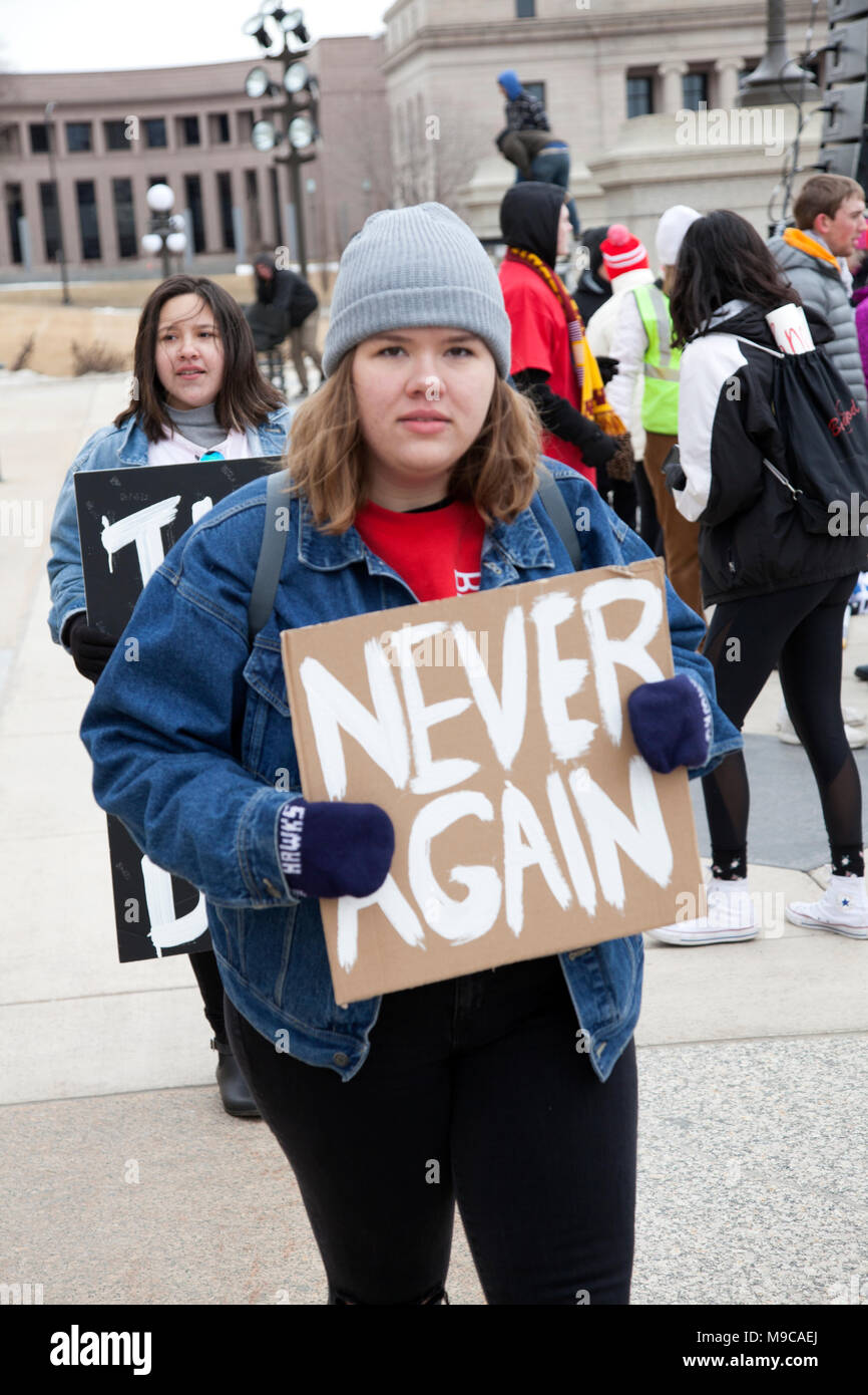 Serious student holding "Never Again" sign at The "March For Our Lives ...