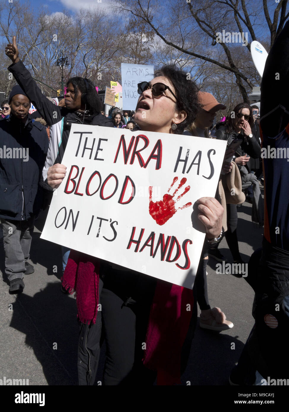 Our blood your hands protest sign hi-res stock photography and images ...