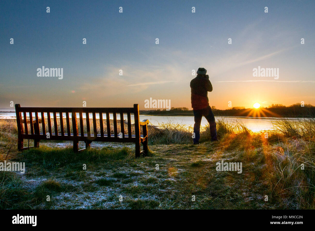 Man birdwatching at dawn Southport, Merseyside. UK Weather. March, 2018 ...