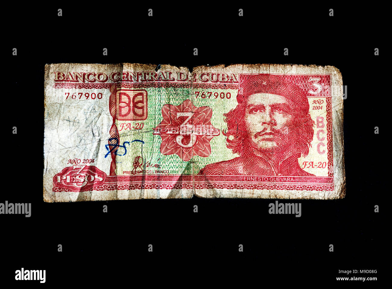 front of bill of three Cuban pesos in which the face of Ernesto Che ...