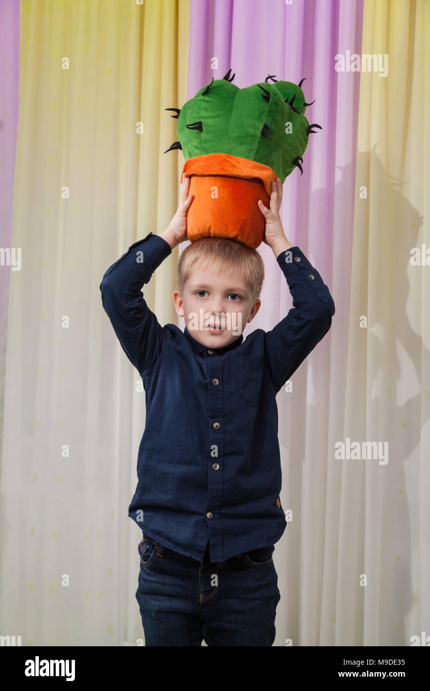 Boy with cactus Stock Photo - Alamy