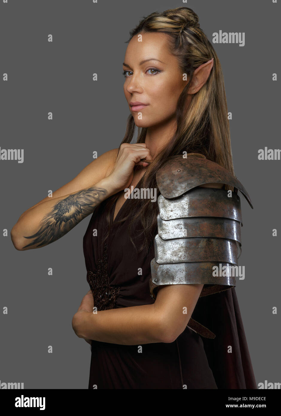 Beautiful elf woman on grey background Stock Photo - Alamy