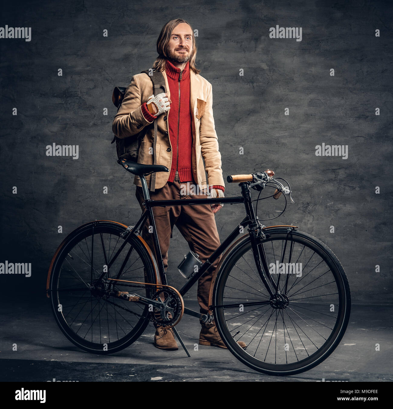 A man posing with bicycle Stock Photo - Alamy