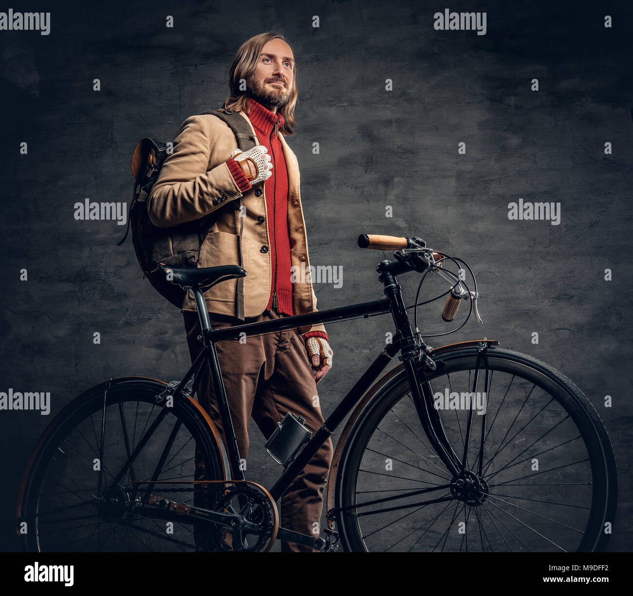 A man posing with bicycle Stock Photo - Alamy