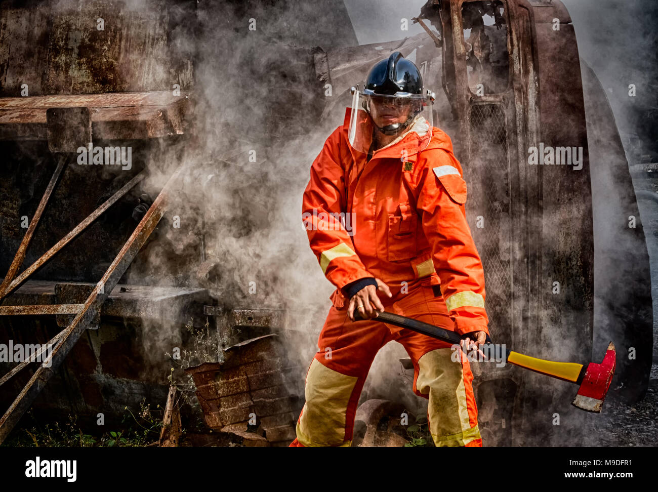 Emergency Fire Rescue training, firefighters in uniform, arm with a ...