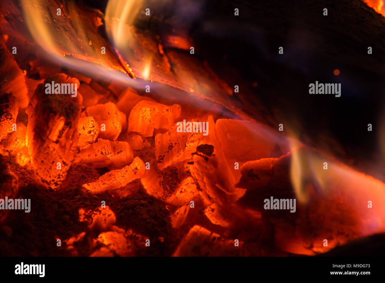 Charcoal in red fire, may use as background Stock Photo - Alamy