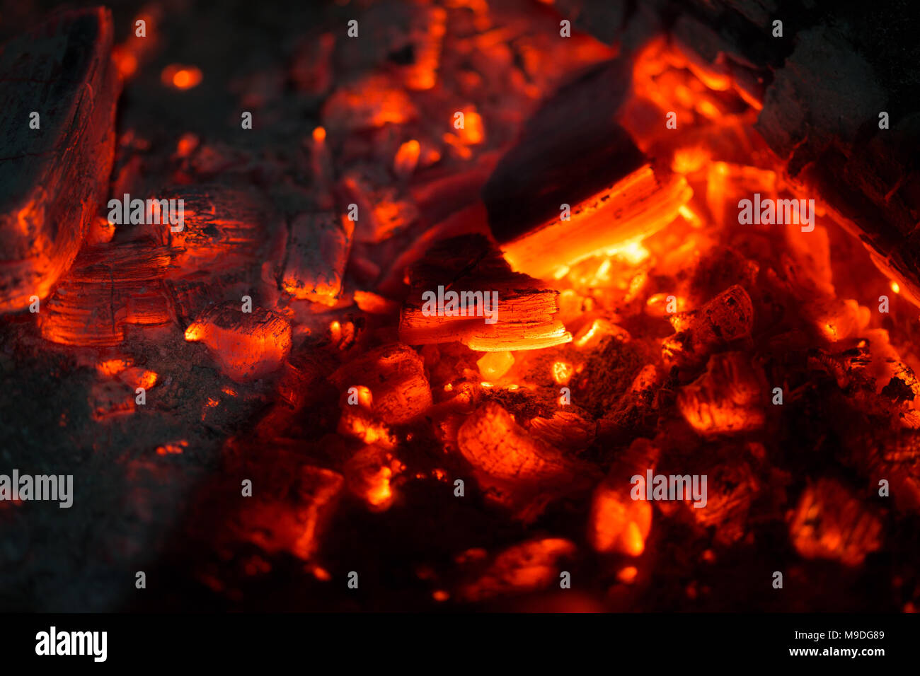 Charcoal in red fire, may use as background Stock Photo - Alamy