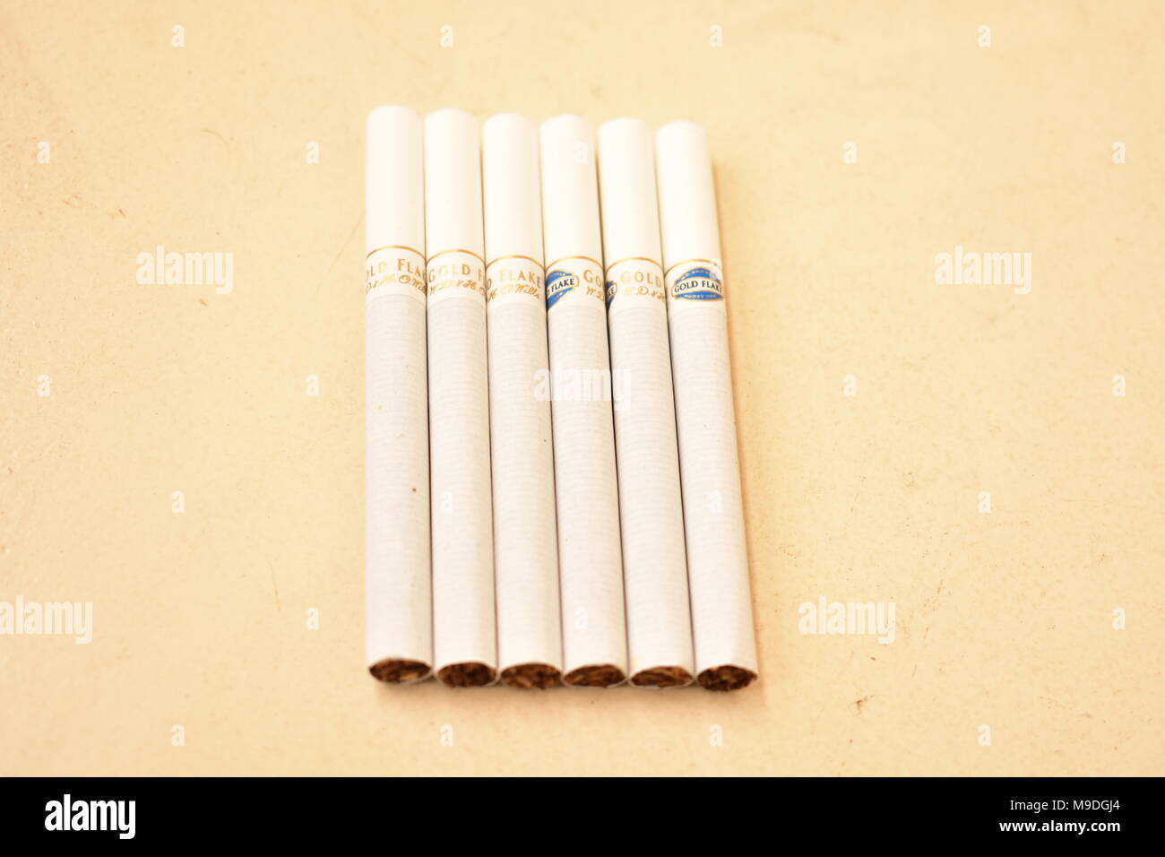 A close look bunch of cigarette at floor Stock Photo - Alamy