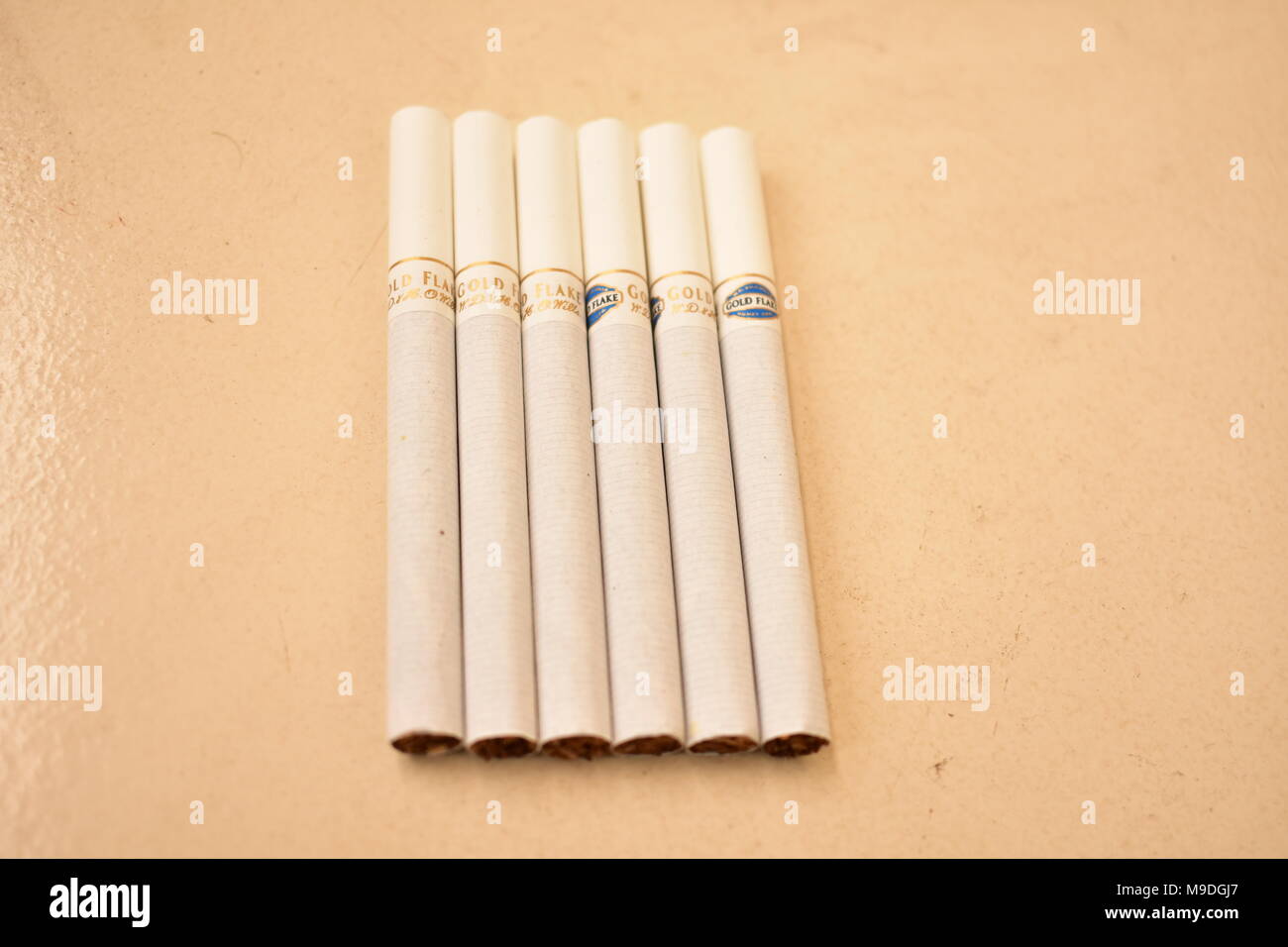 A close look bunch of cigarette at floor Stock Photo - Alamy