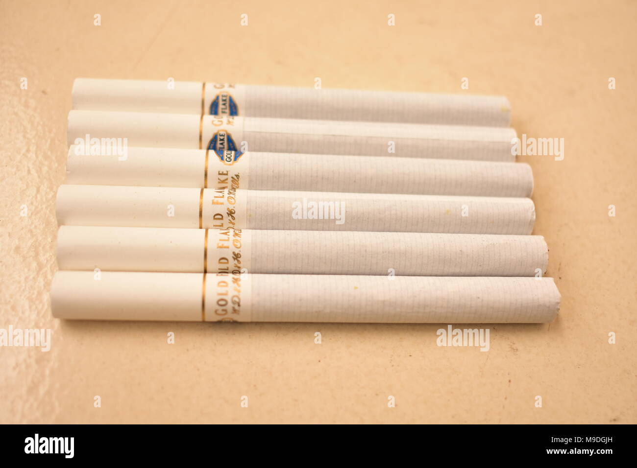 A close look bunch of cigarette at floor Stock Photo - Alamy