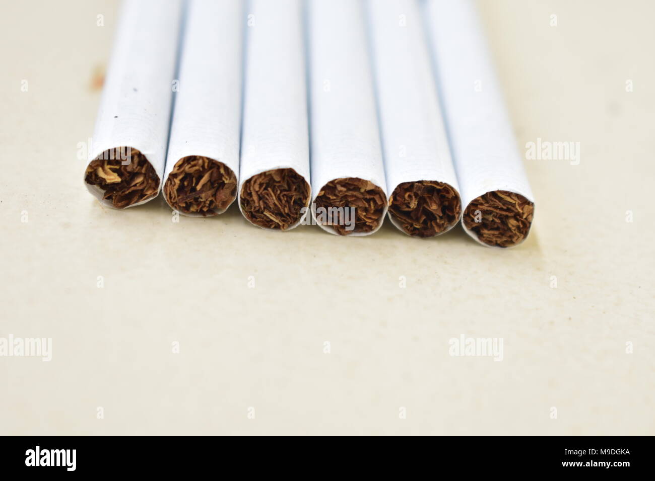 A close look bunch of cigarette at floor Stock Photo - Alamy