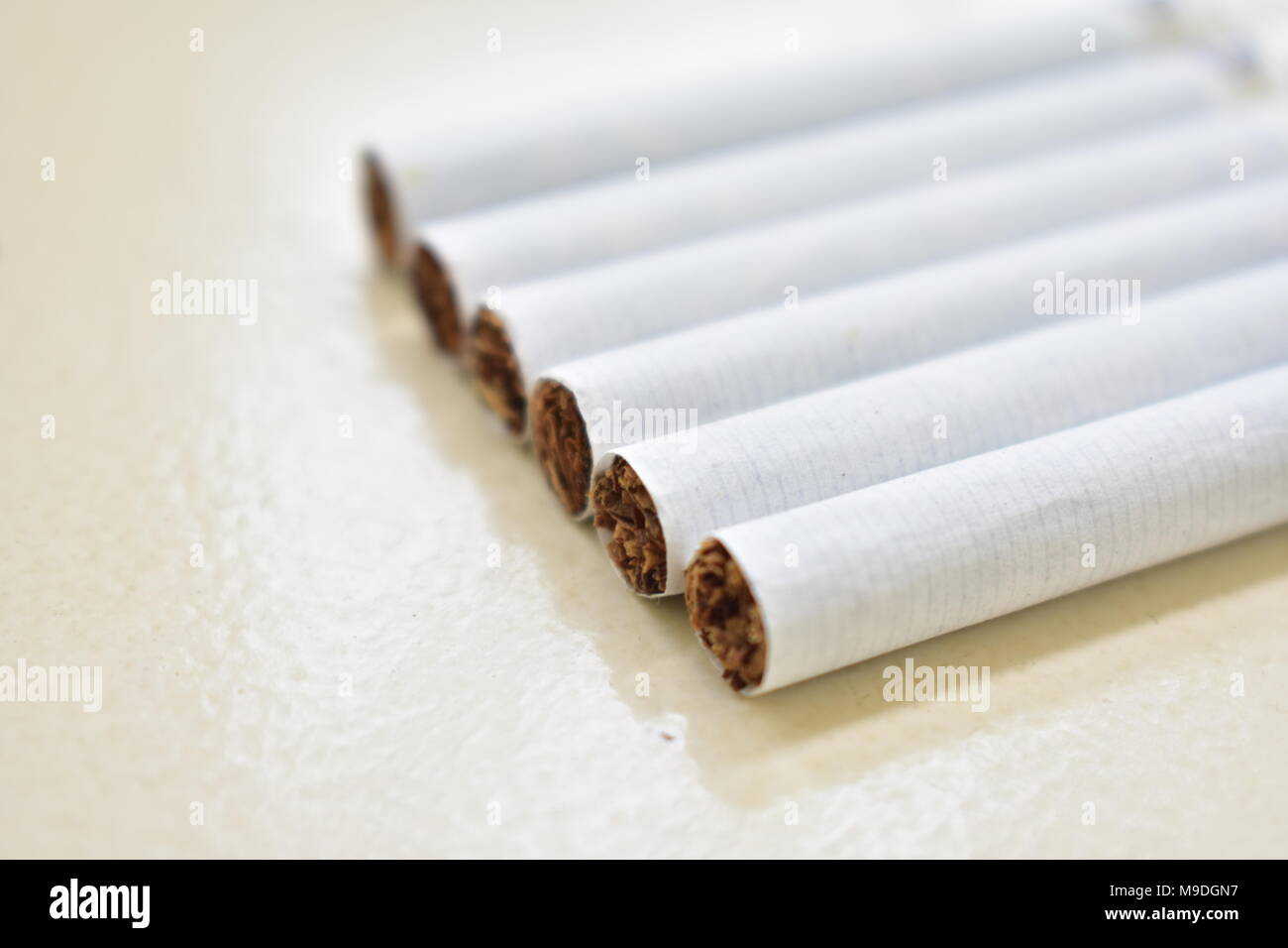 A close look bunch of cigarette at floor Stock Photo - Alamy