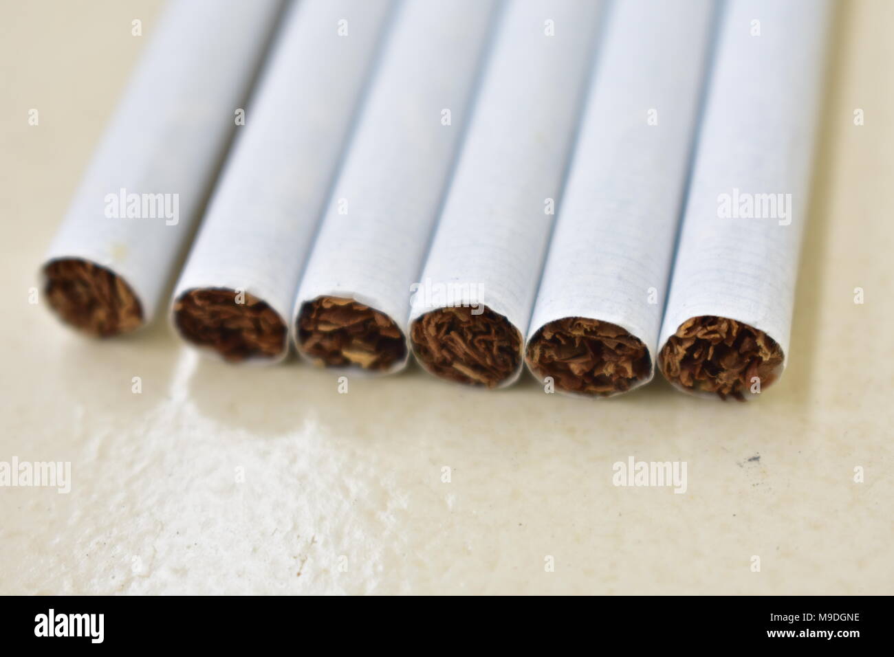 A close look bunch of cigarette at floor Stock Photo - Alamy