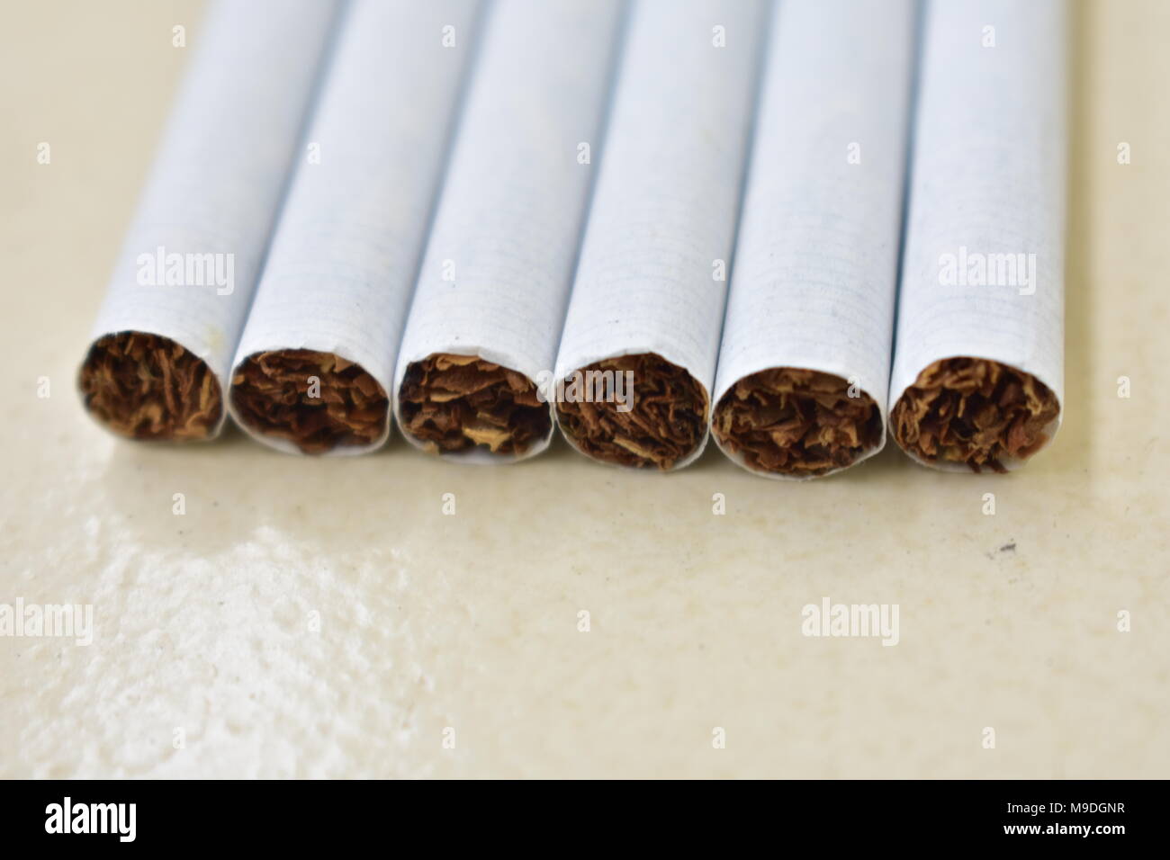 A close look bunch of cigarette at floor Stock Photo - Alamy