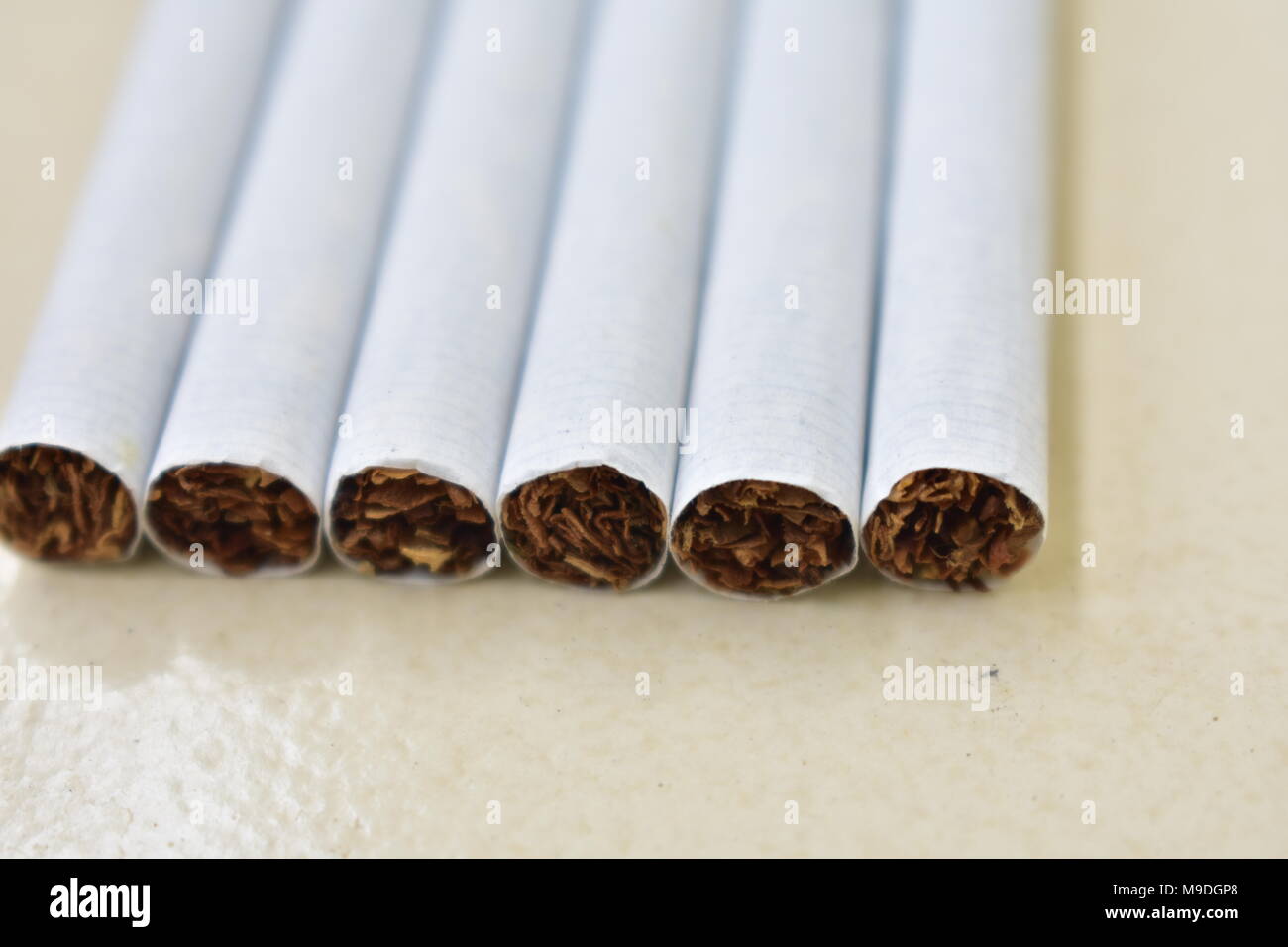 A close look bunch of cigarette at floor Stock Photo - Alamy