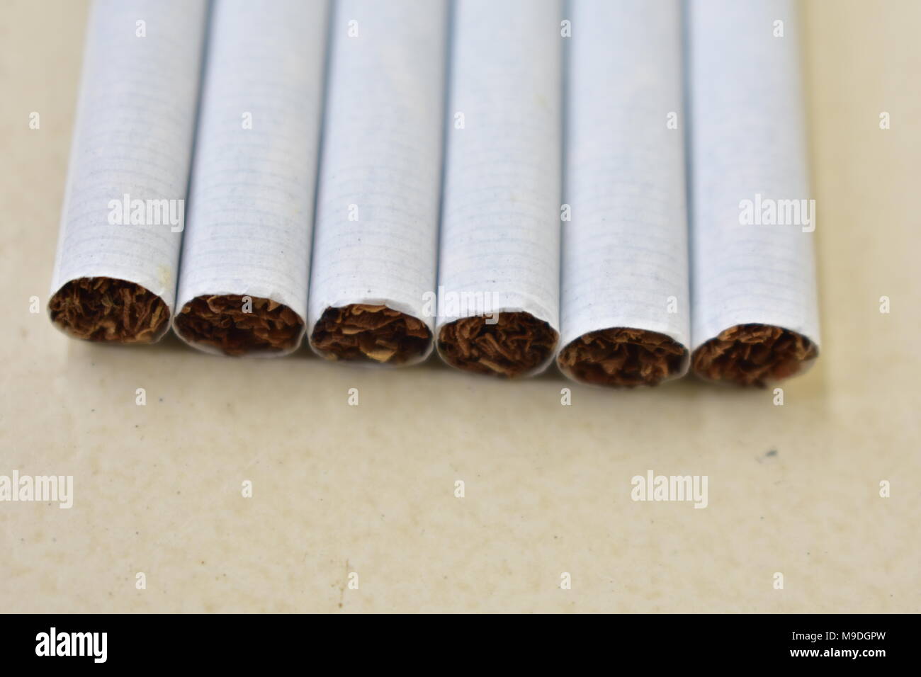 A close look bunch of cigarette at floor Stock Photo - Alamy