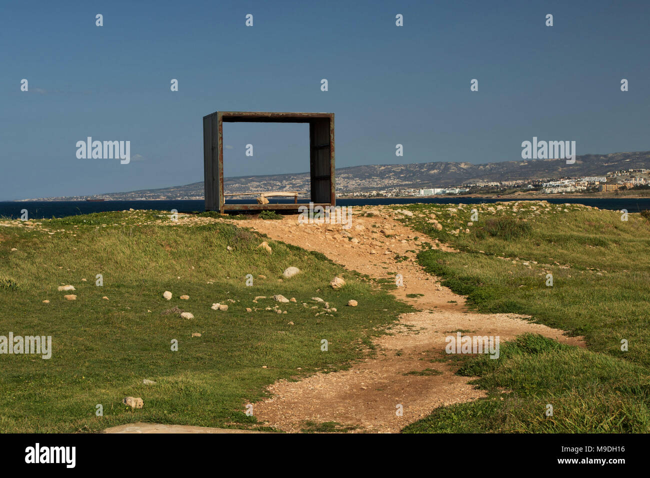Rough path leading to covered bench on the mediterranean coast in ...