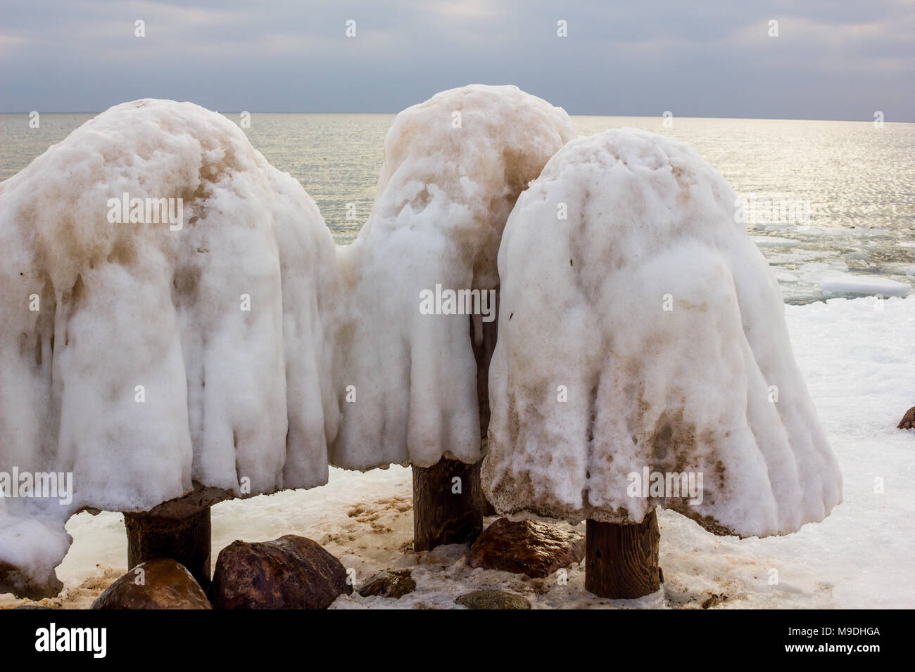 Jetty Pillar Covered with Snow, Looking like a Mushroom on a Sunny ...