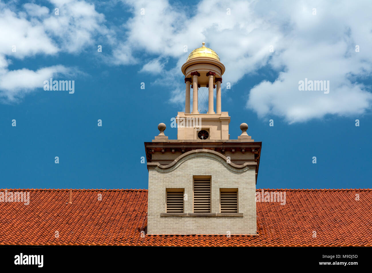 Blue sky and orange tiled roof with a golden colored dome Stock Photo ...