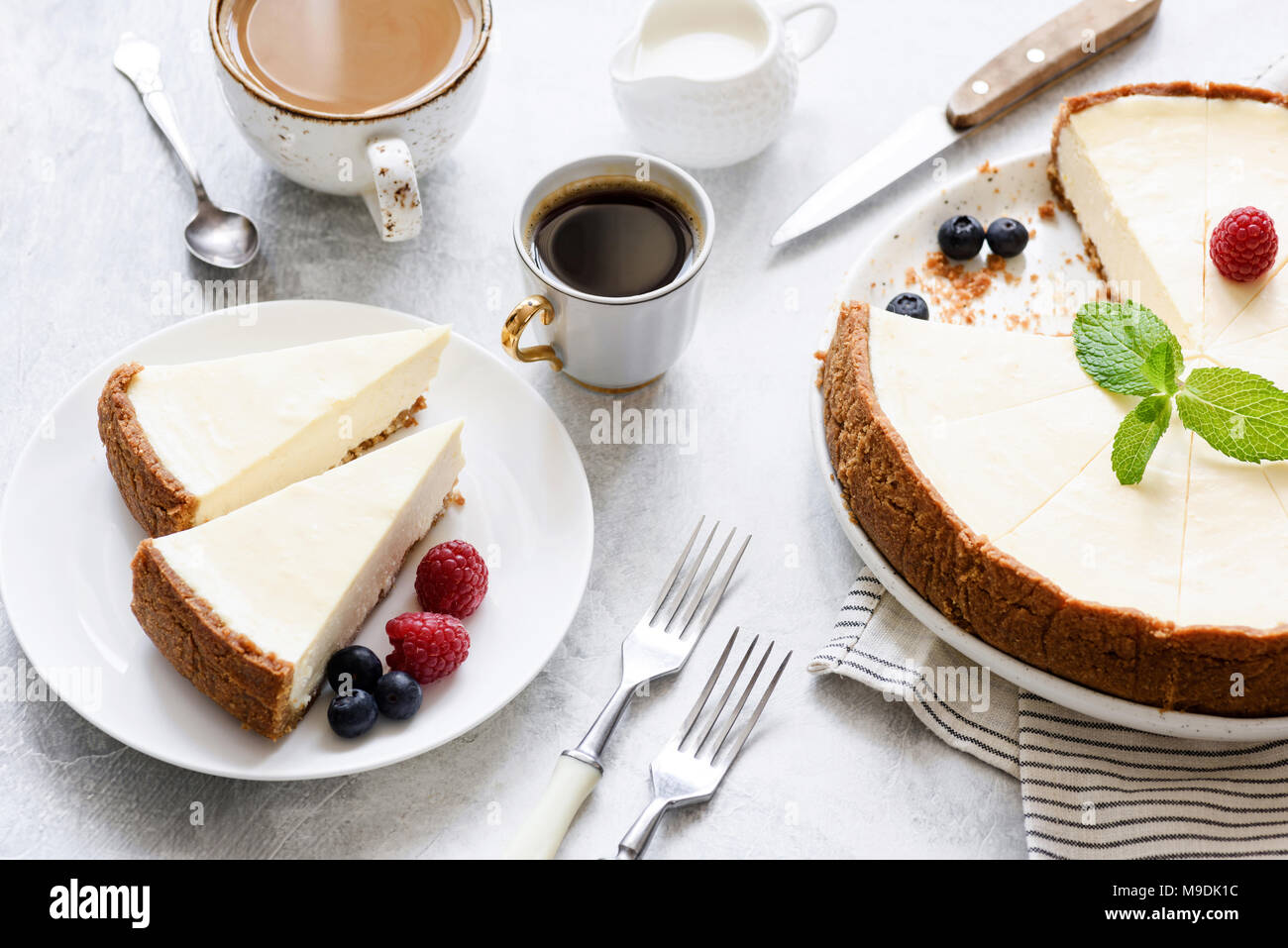 Classic New York Cheesecake and coffee on white concrete background ...