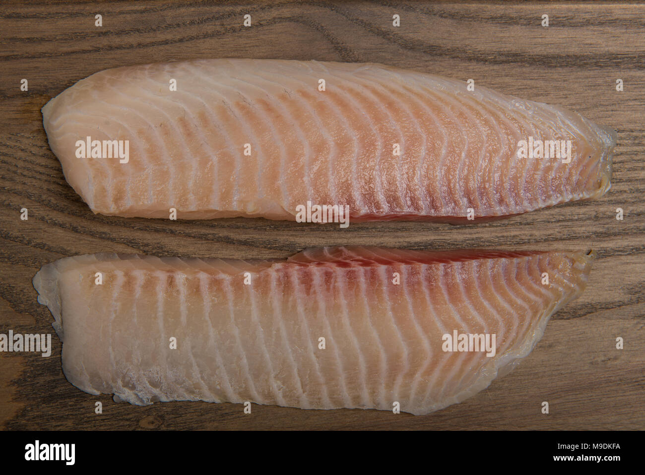 Close up of fresh or unfrozen set of filleted fish Stock Photo - Alamy