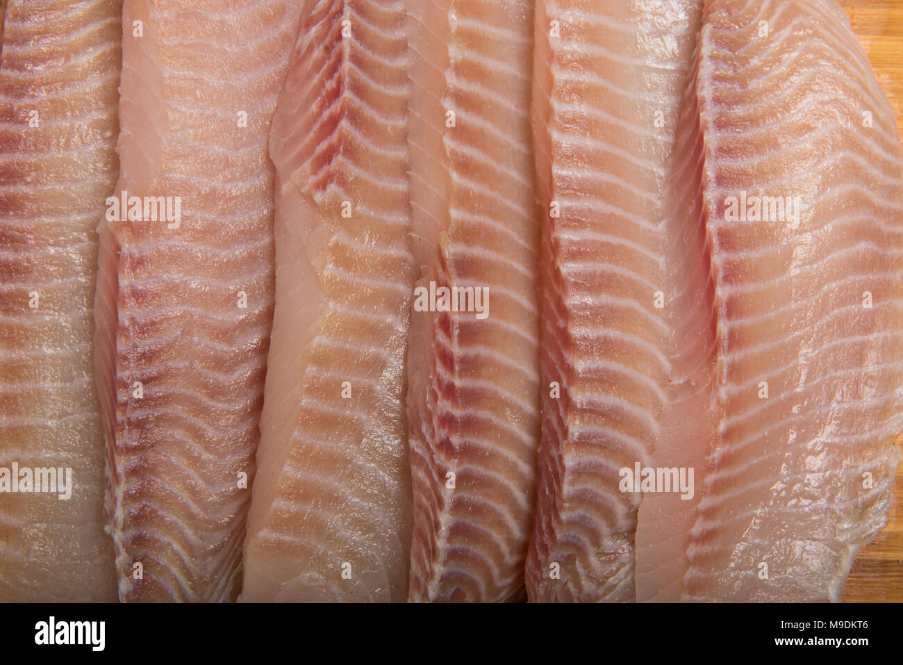 Close up of fresh or unfrozen set of filleted fish Stock Photo - Alamy