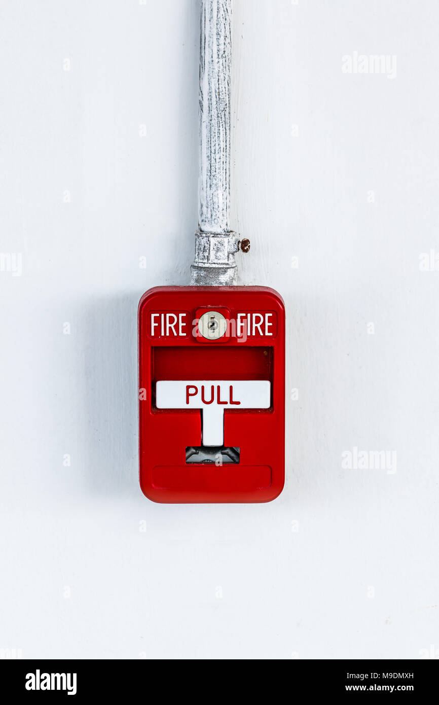Old red box fire alarm isolated on white background Stock Photo - Alamy