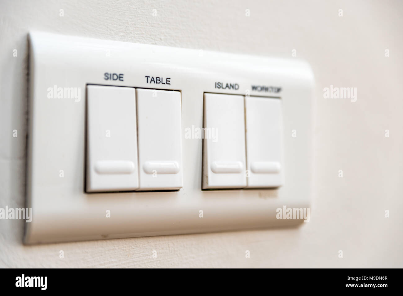 Close up view light switches with name Table on it Stock Photo - Alamy