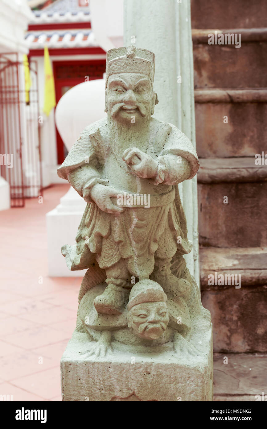 Stone statue of Chinese god in public temple Stock Photo - Alamy