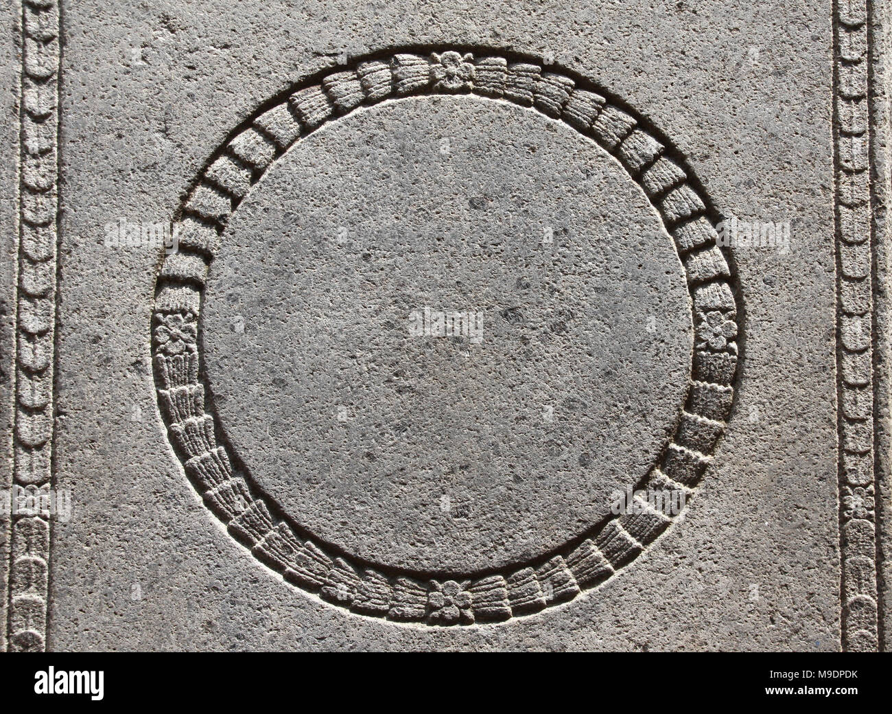 Detail of an ancient ornamental carved stone frame with floral ...