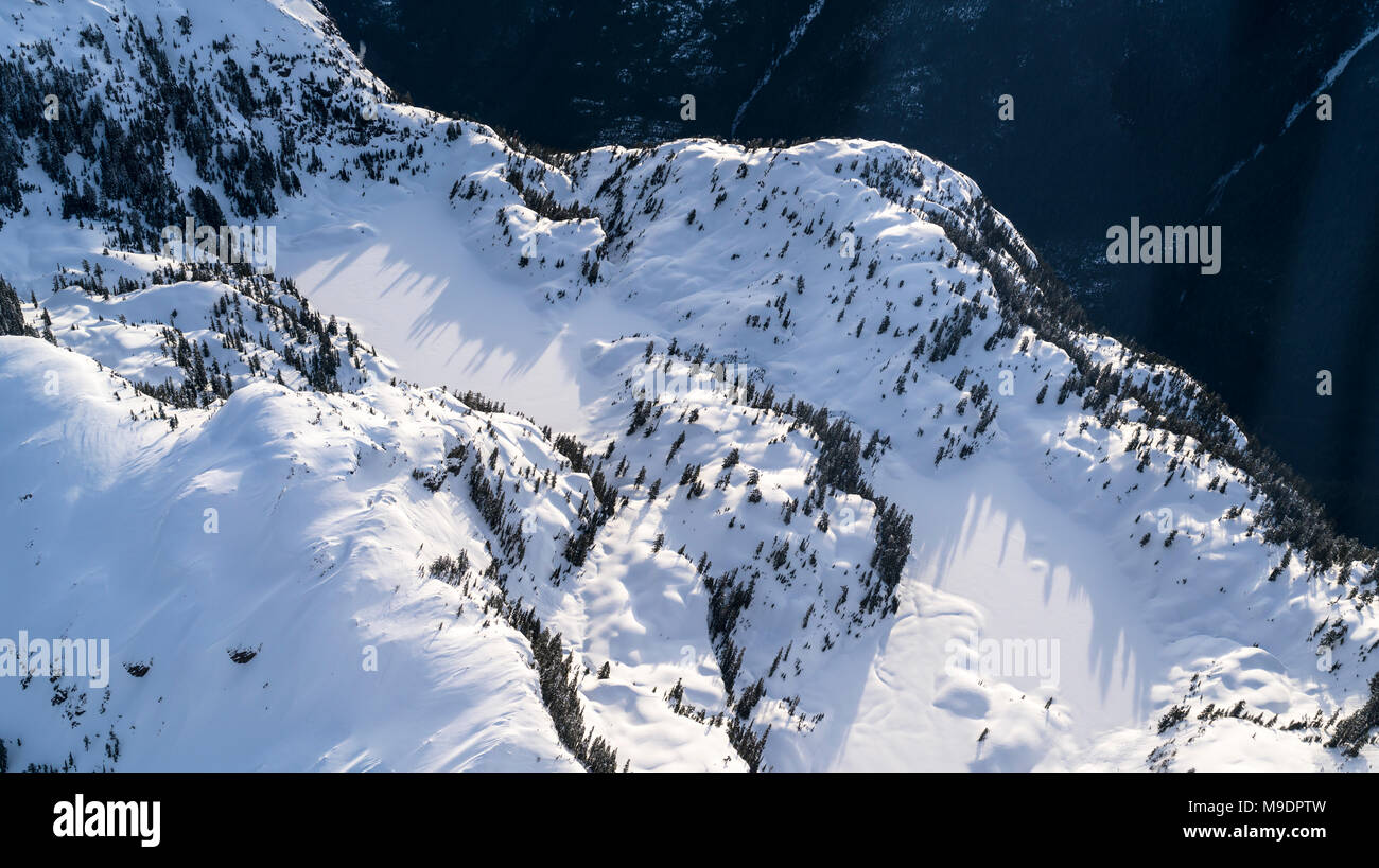 Flying through clouds mountain range hi-res stock photography and ...