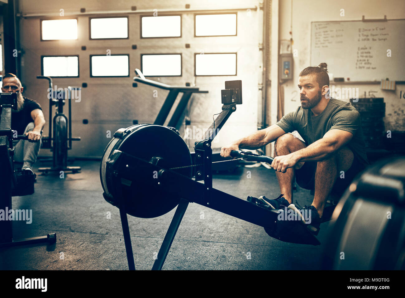 Exercise on rowing machine hi-res stock photography and images - Alamy