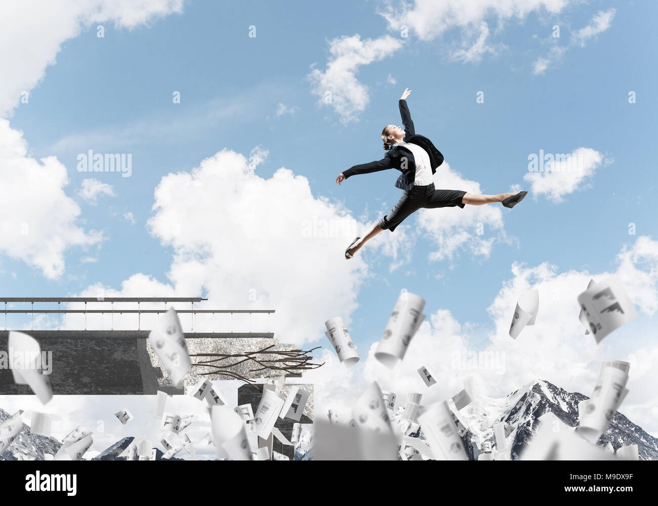 Business woman jumping over gap in bridge among flying papers as symbol ...