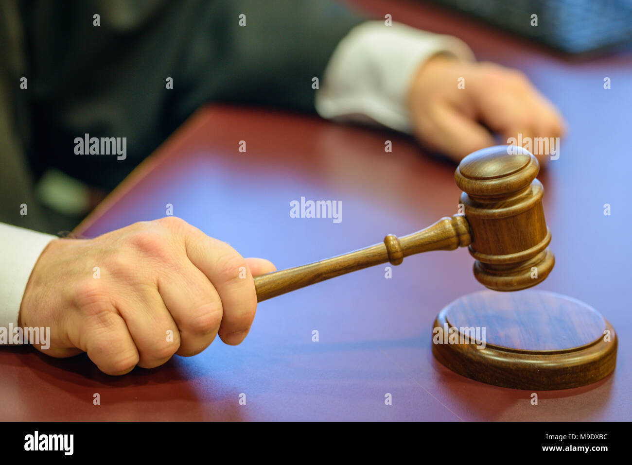 Judges gavel in hand hi-res stock photography and images - Alamy