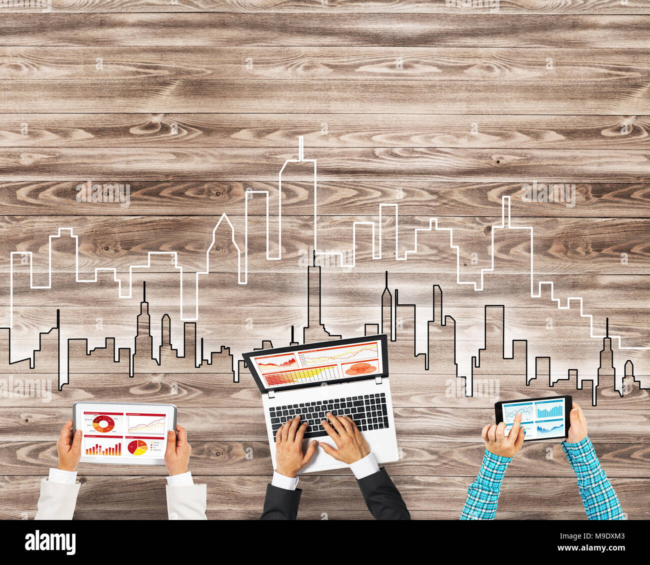 Group of three people with devices in hands working together as symbol ...