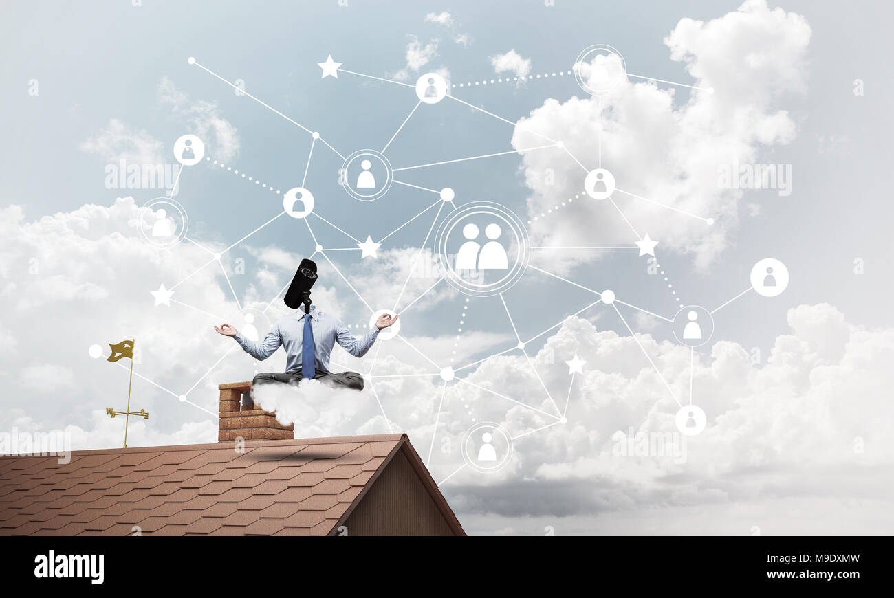 Faceless businessman with camera zoom instead of head sitting in lotus ...