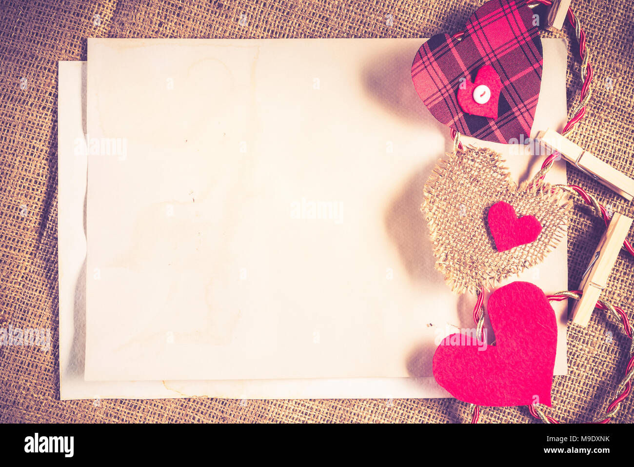 Handmade love hearts and sheets of blank paper Stock Photo - Alamy