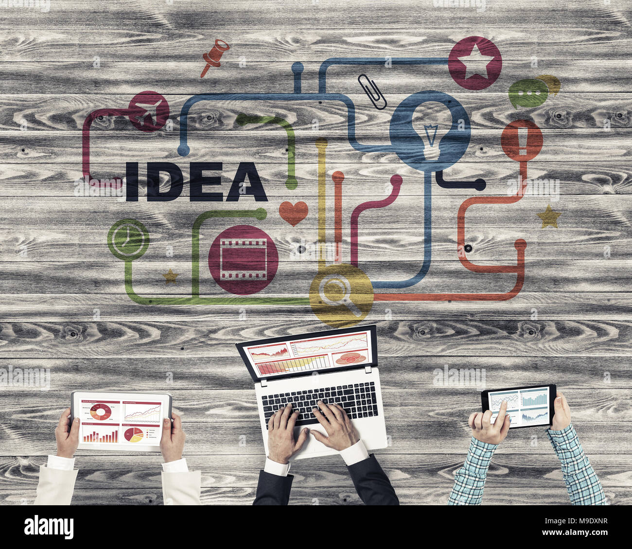 Group of three people with devices in hands working together as symbol ...